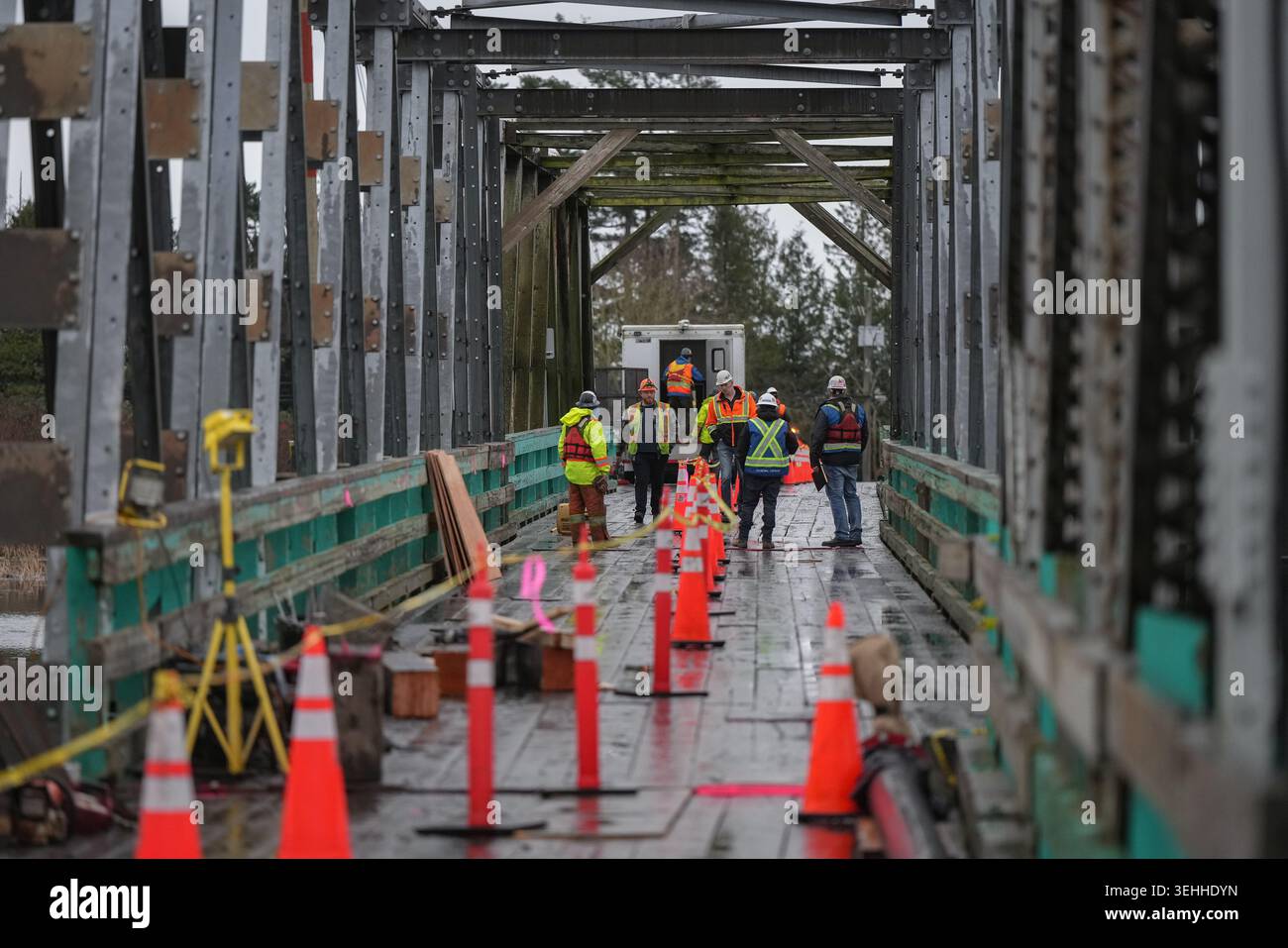 Workers gather on the Westham Island Bridge, which is closed to vehicle ...