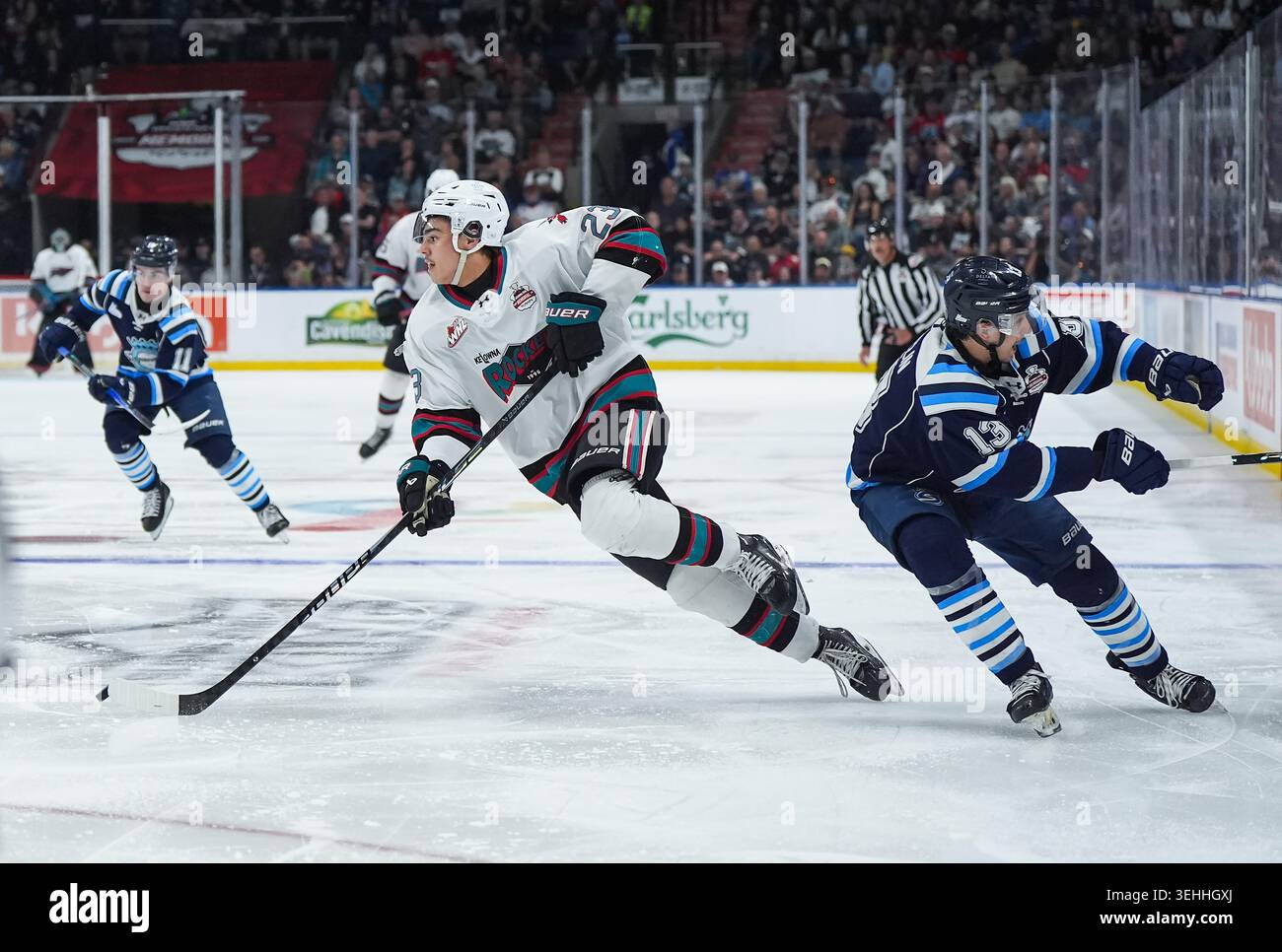 Kelowna Rockets' Hayden Paupanekis (23) avoids a collision with ...