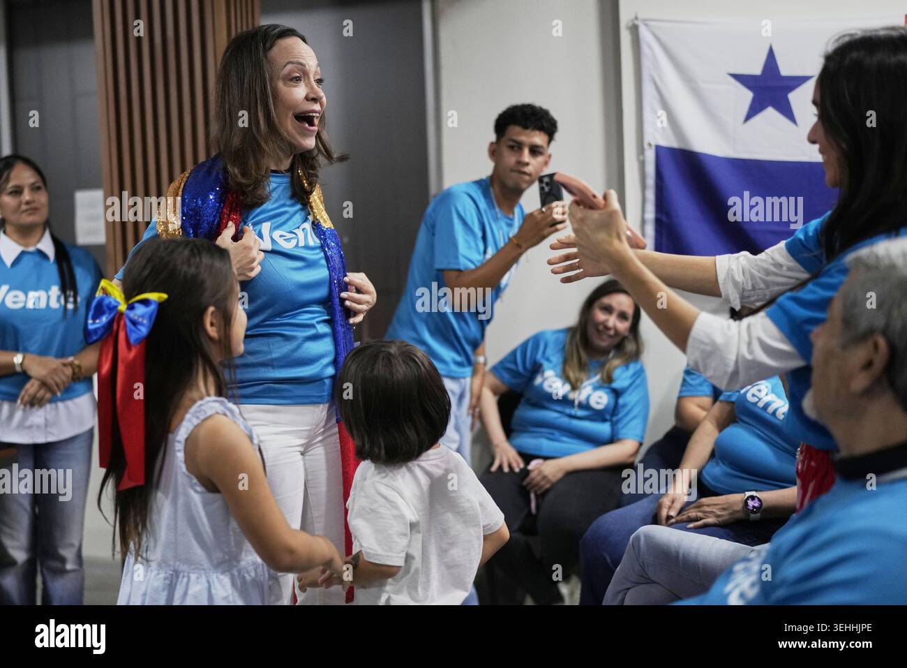 Venezuela's opposition leader Maria Corina Machado receives a gift at ...