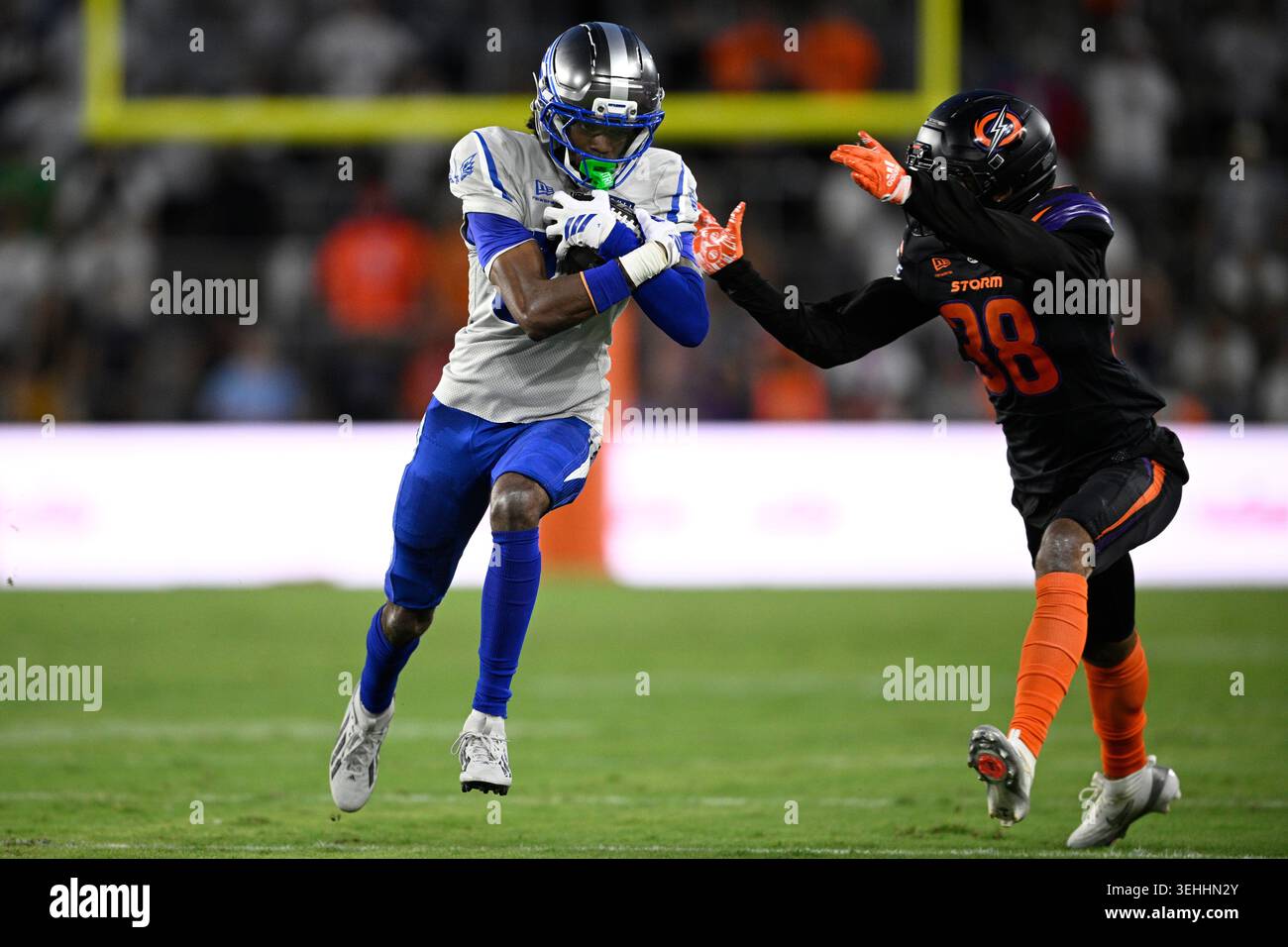 St. Louis Battlehawks tight end Tyler Neville, left, runs after ...
