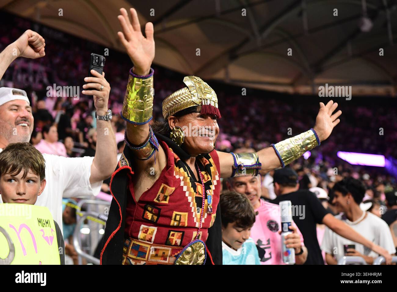 An Inter Miami fan waves to the camera during the match between Inter ...