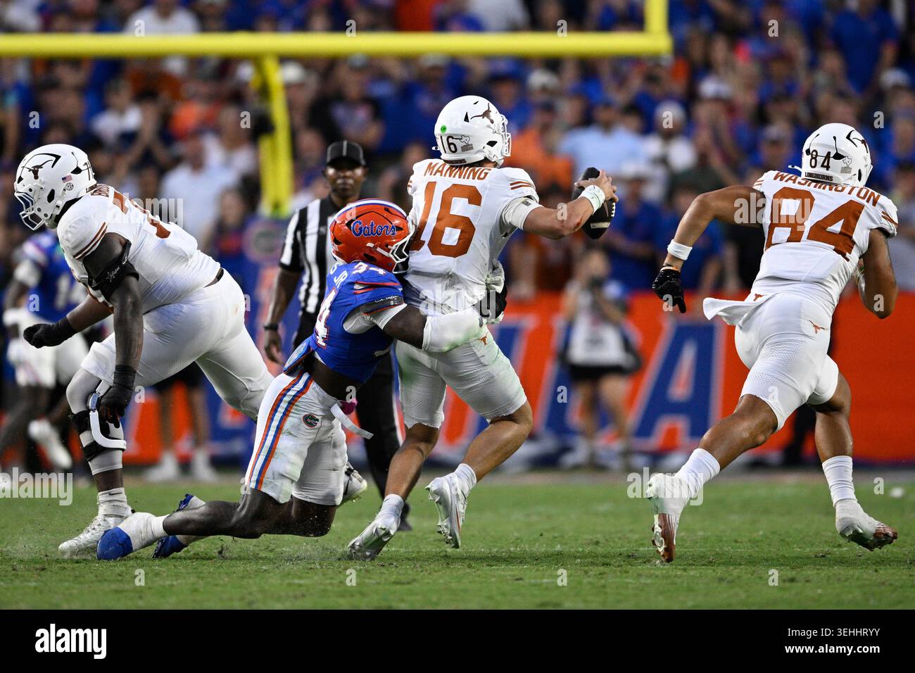 Texas quarterback Arch Manning (16) is sacked by Florida defensive end ...