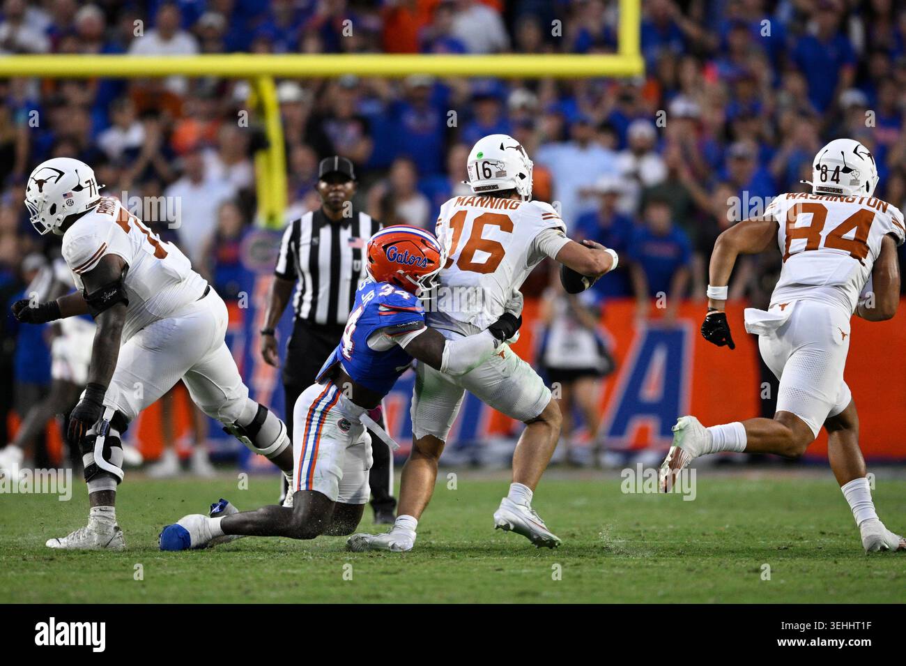Texas quarterback Arch Manning (16) is sacked by Florida defensive end ...