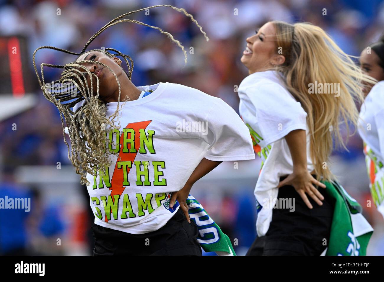 Florida dancers perform on the field during the second half of an NCAA ...