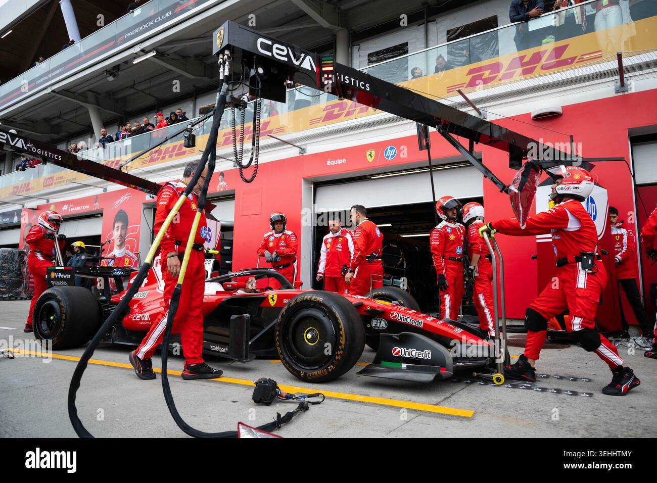 This photo is an illustration showing the Ferrari car in the pit lane ...