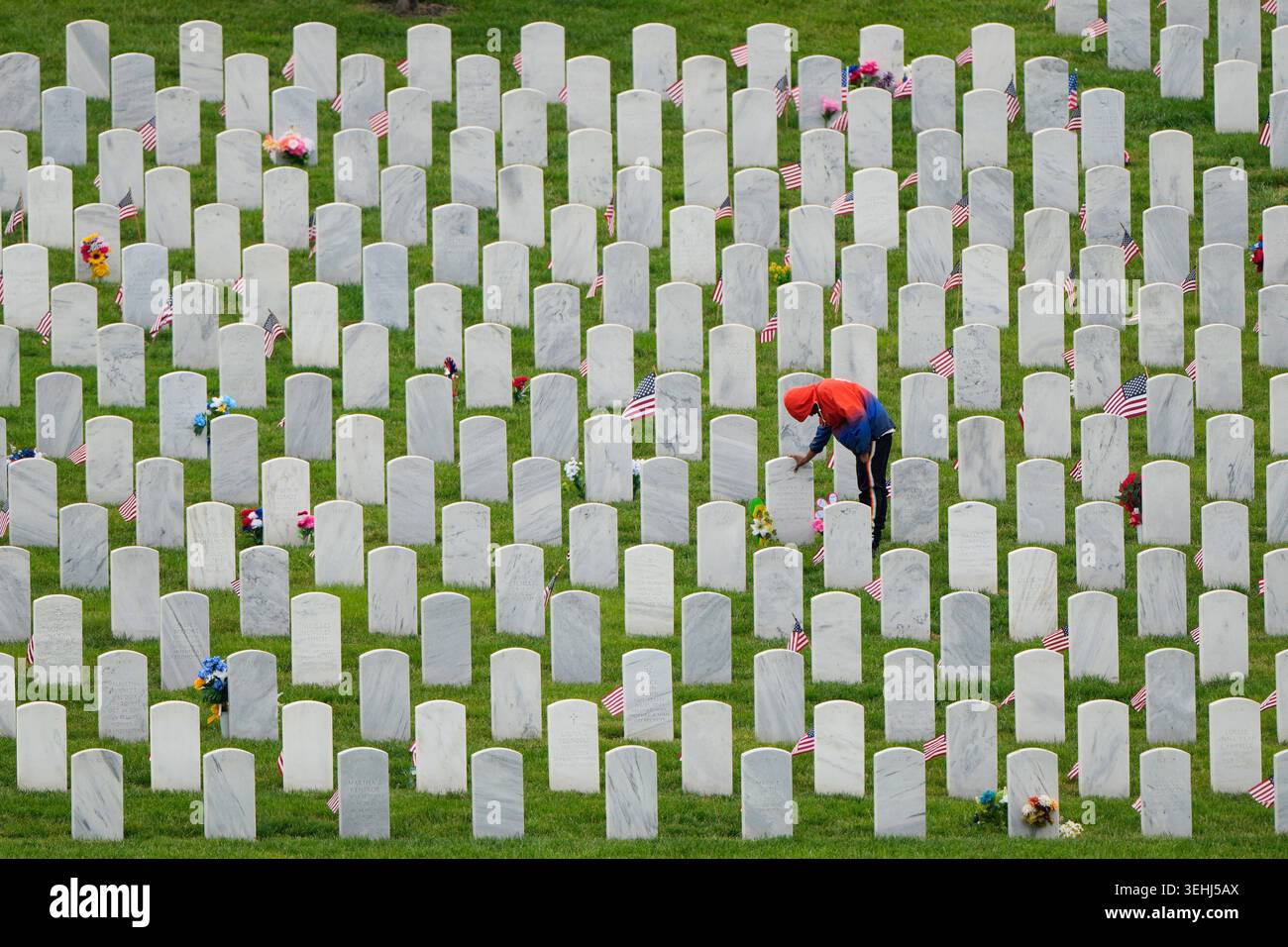 FILE - Richard Cross touches his grandmother's headstone while visiting ...