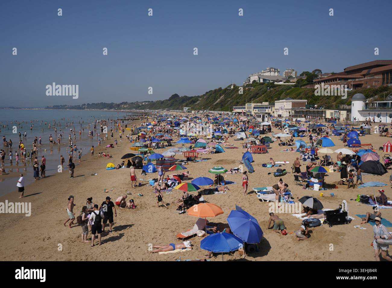 People enjoy the hot weather on Bournemouth beach in Dorset. Monday is ...