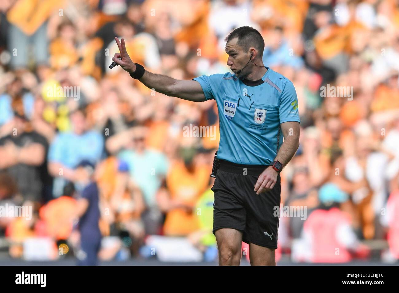 Referee Jared Gillett signals two minutes left during the Sky Bet ...