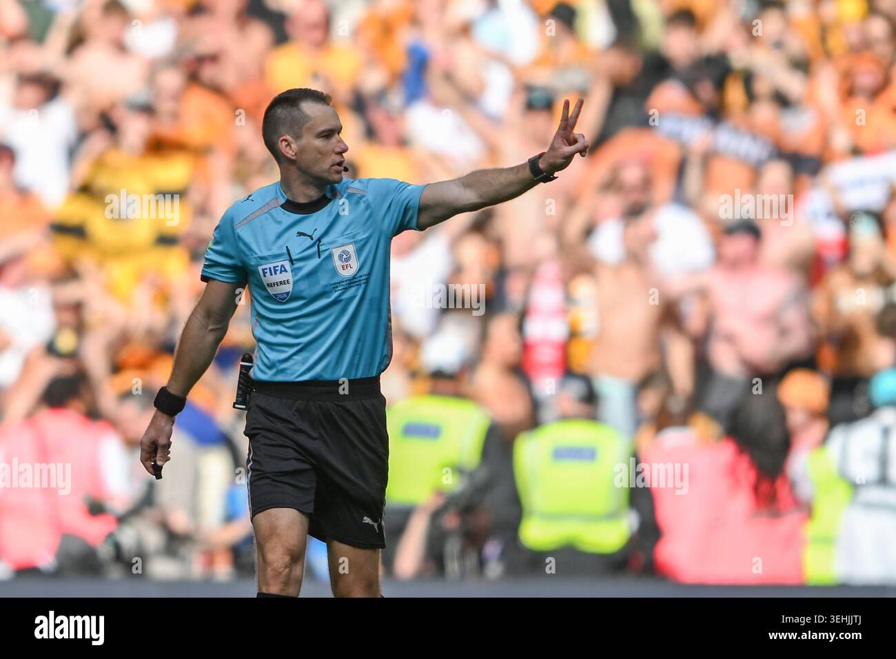 Referee Jared Gillett signals two minutes left during the Sky Bet ...