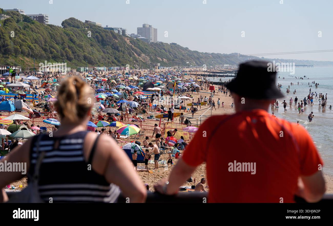People enjoy the hot weather on Bournemouth beach in Dorset. Monday is ...