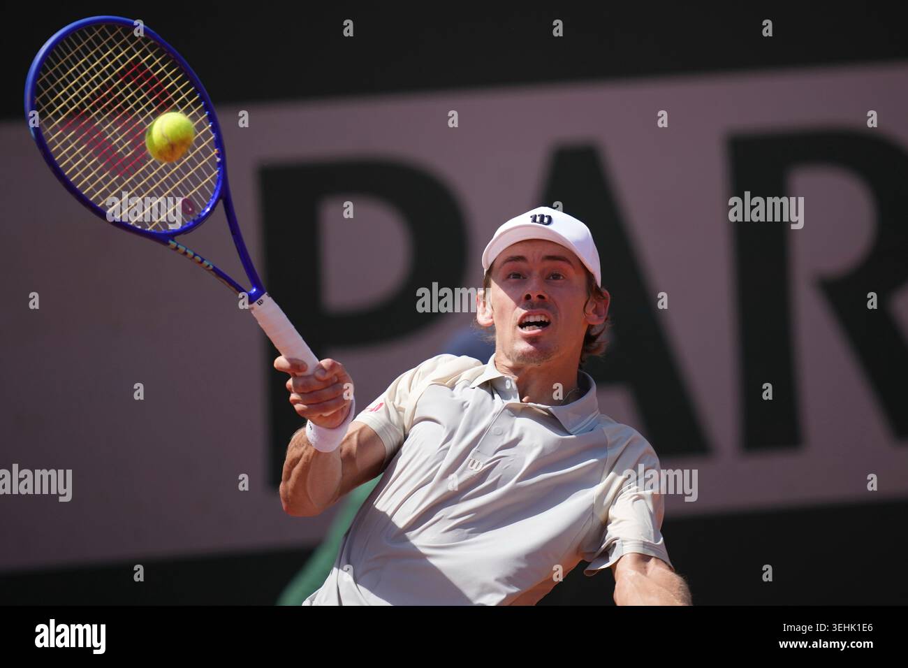 Alex De Minaur of Australia returns to Toby Samuel of Britain during ...