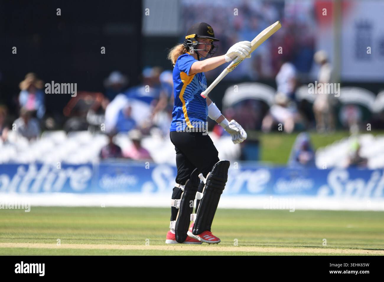 Canterbury, England. 25th May 2026. Mollie Adams raises her bat after ...