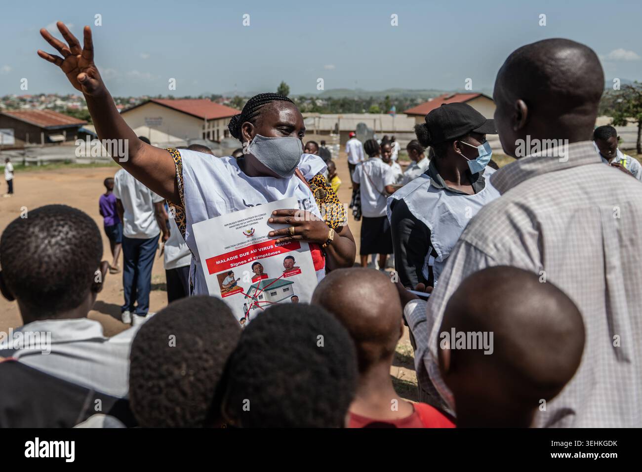 Vanny Birungi, a Red Cross volunteer, speaks to people during a public ...