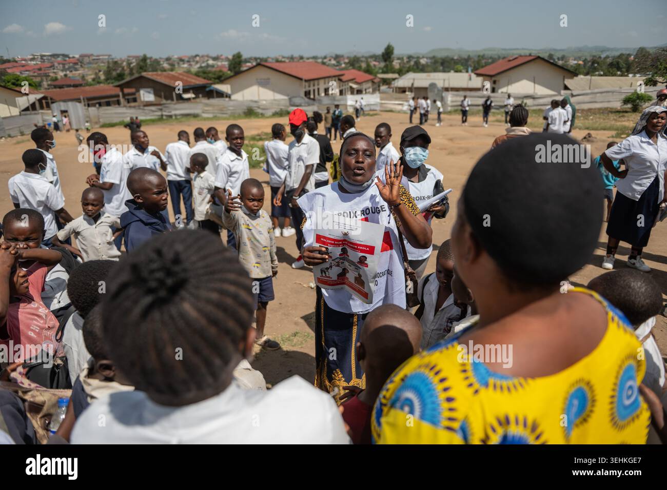 Vanny Birungi, a Red Cross volunteer, speaks to people during a public ...