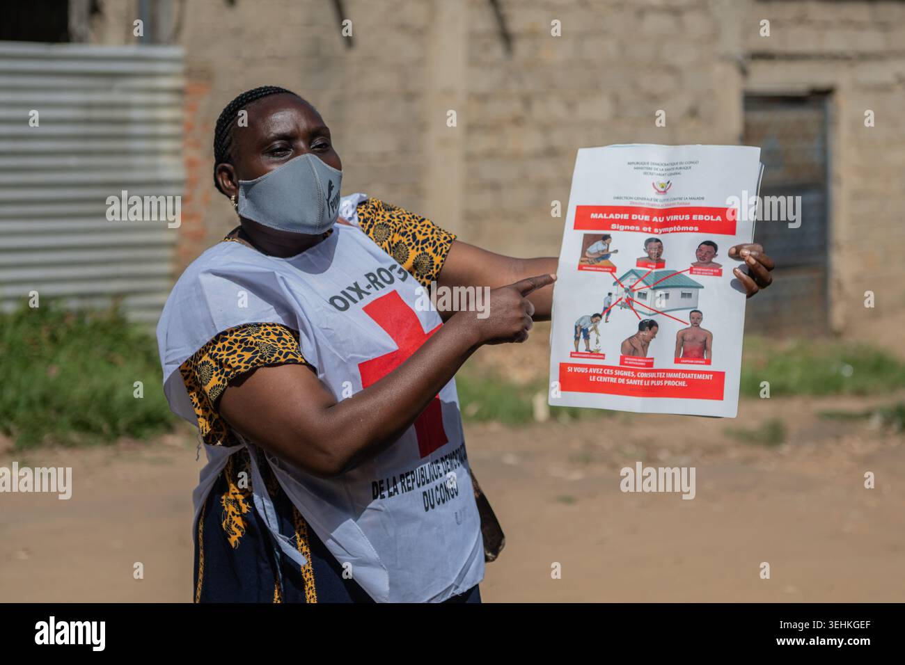 Vanny Birungi, a Red Cross volunteer, on a house-to-house sensitisation ...