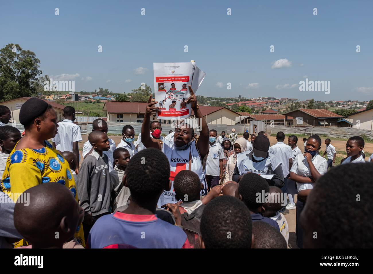Vanny Birungi, a Red Cross volunteer, speaks to people during a public ...