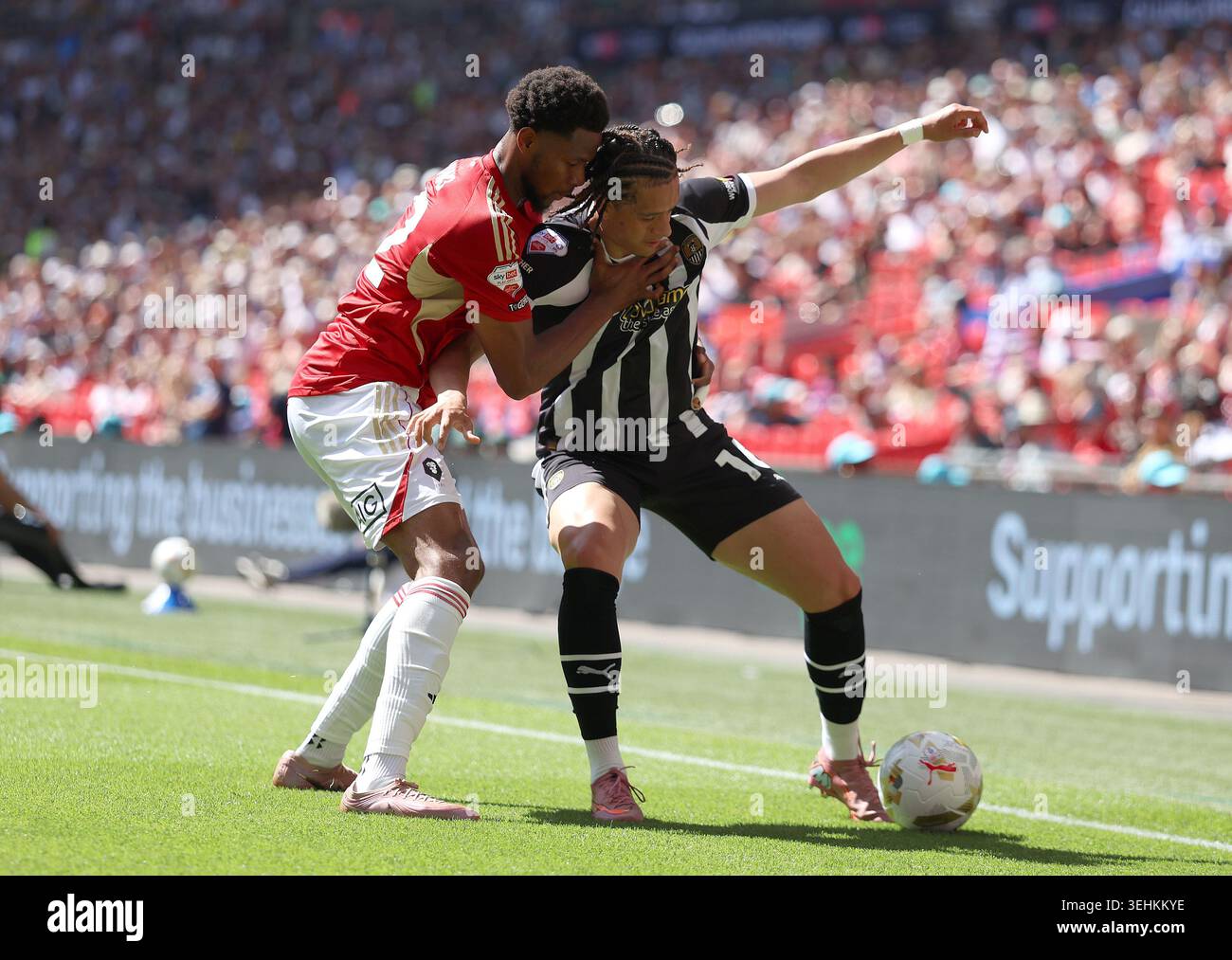 Salford City's Adebola Oluwo (left) and Notts County's Jayden Luker ...