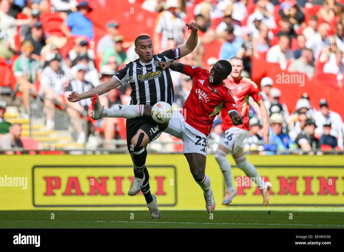 Rod McDonald of Notts County battles with Daniel Udoh of Salford City ...