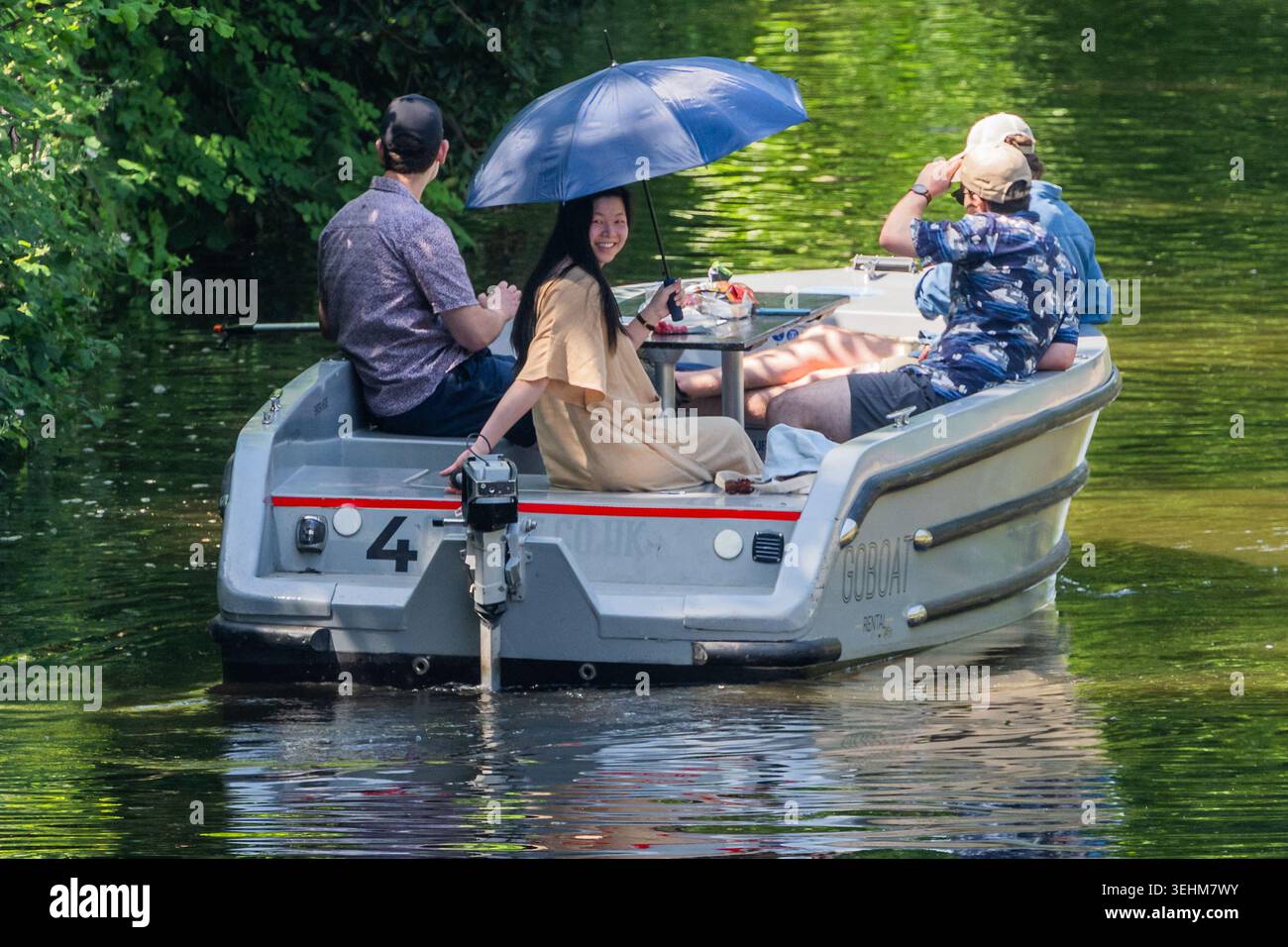 London, UK. 25 May 2026. Umbrellas as parasols on the hire boats on the ...
