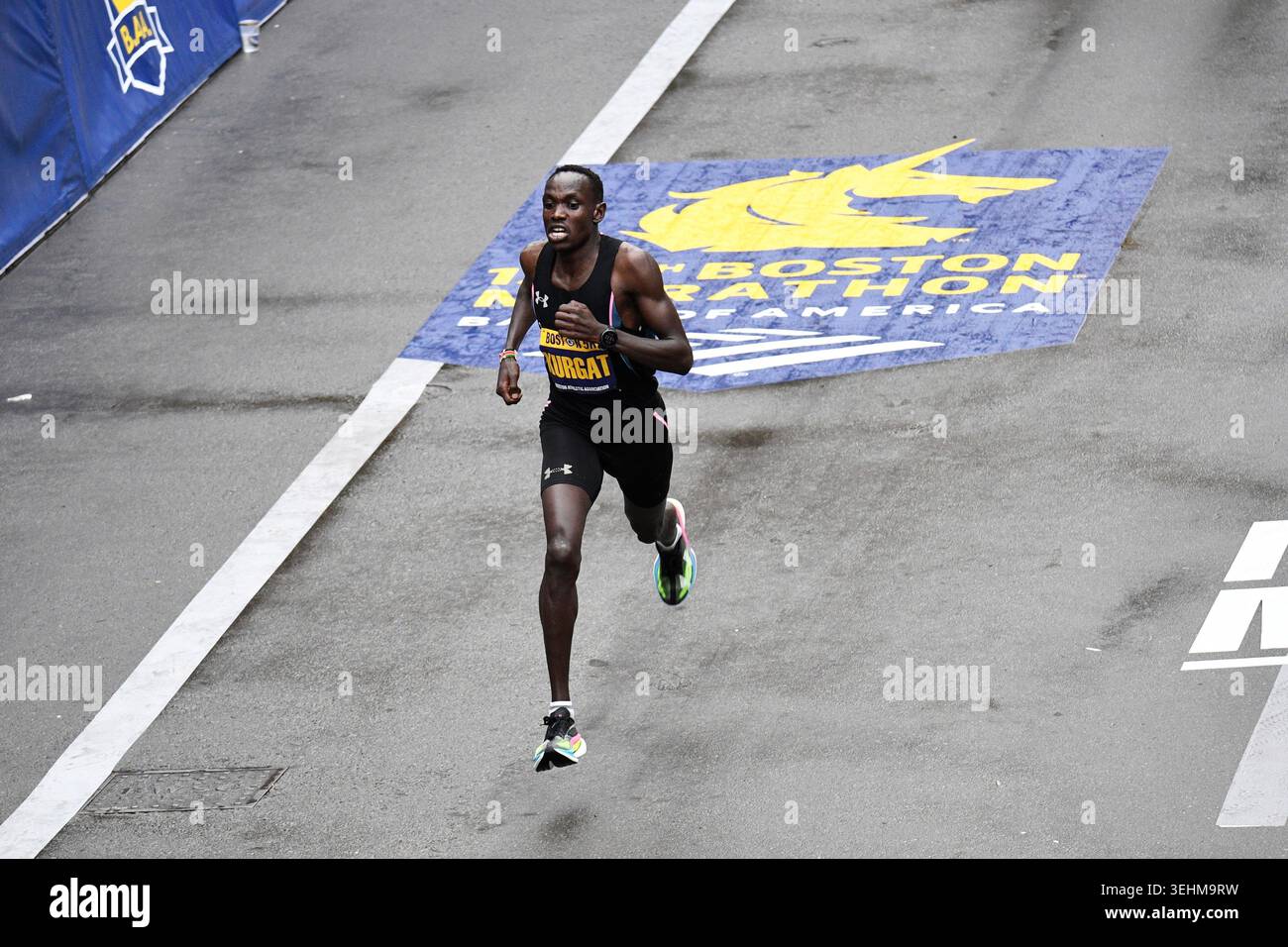 BOSTON, MA - APRIL 18: Edwin Kurgat of Kenya runs to the finish line of ...