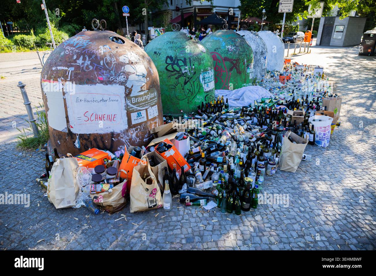 25 May 2026, Berlin: Numerous bottles lie on the ground at the ...