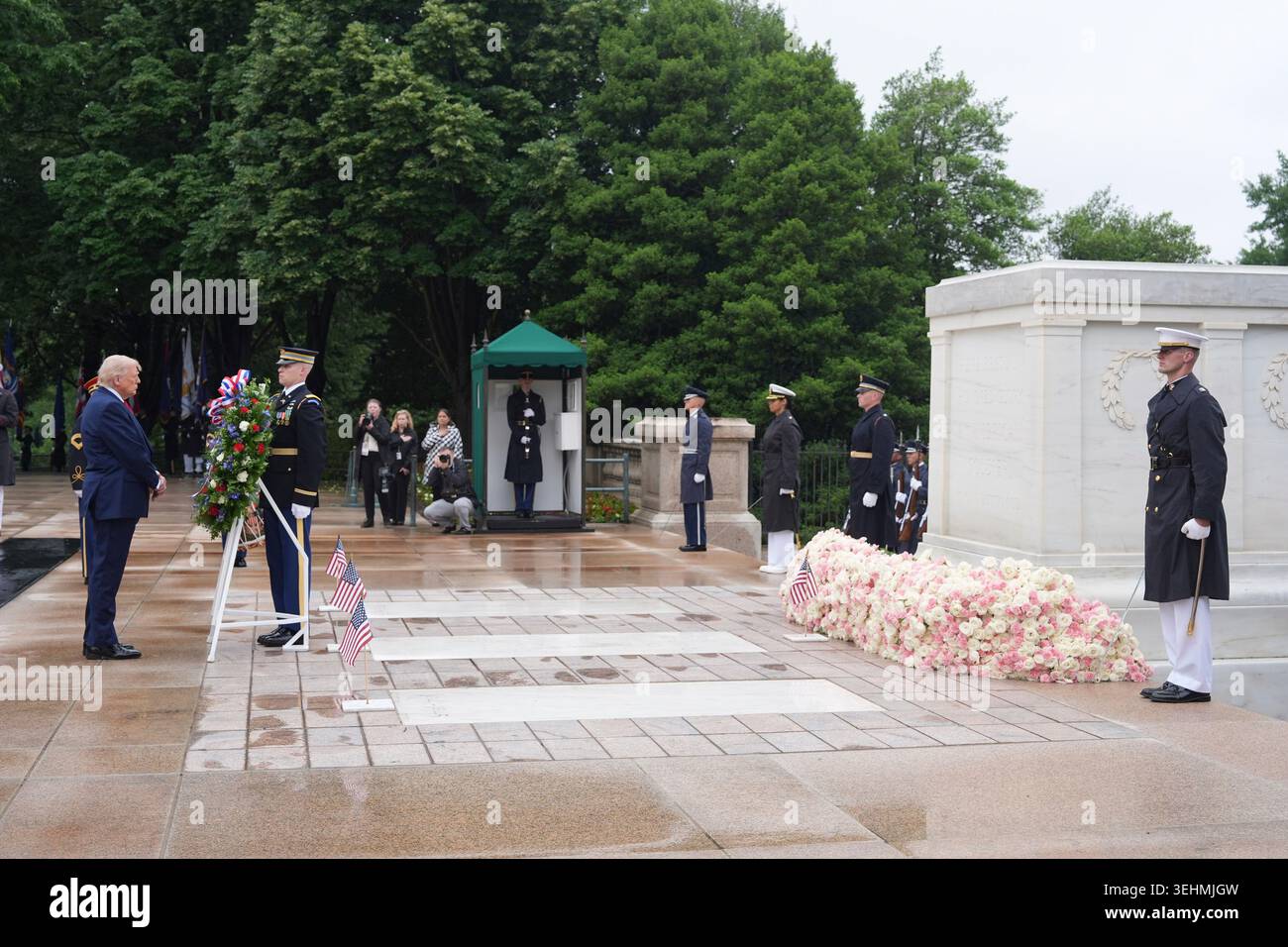 President Donald Trump, left, places a wreath at the Tomb of the ...