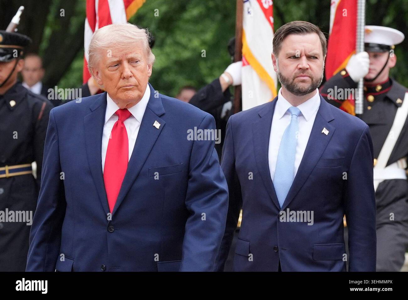 President Donald Trump, left, and Vice President JD Vance walk to the ...