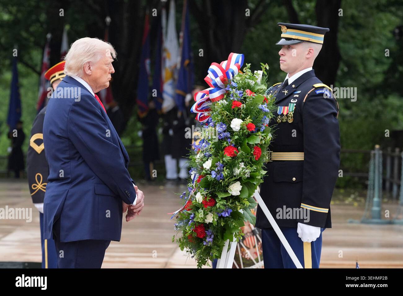 President Donald Trump, left, places a wreath at the Tomb of the ...