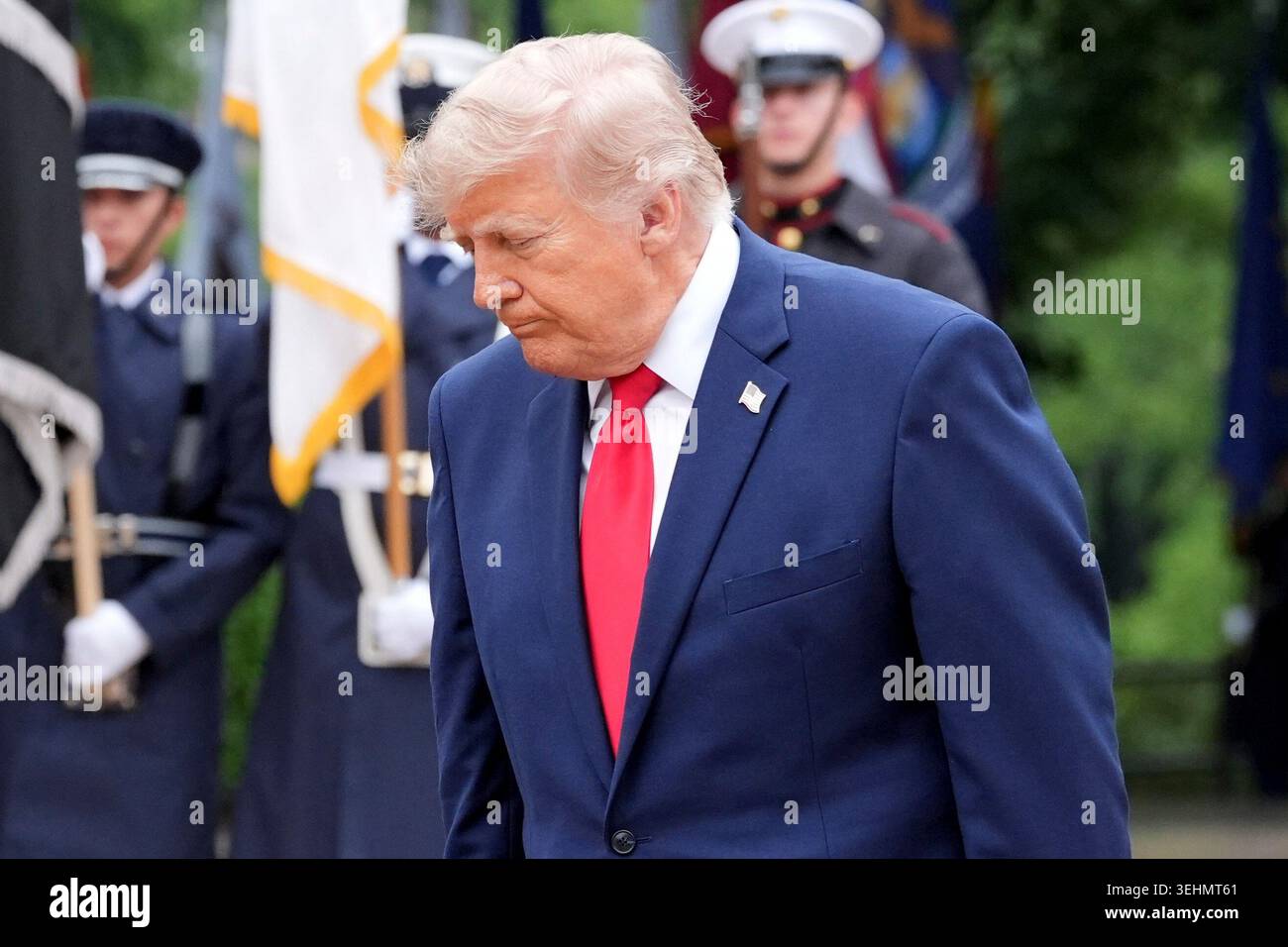 President Donald Trump walks after placing a wreath at the Tomb of the ...
