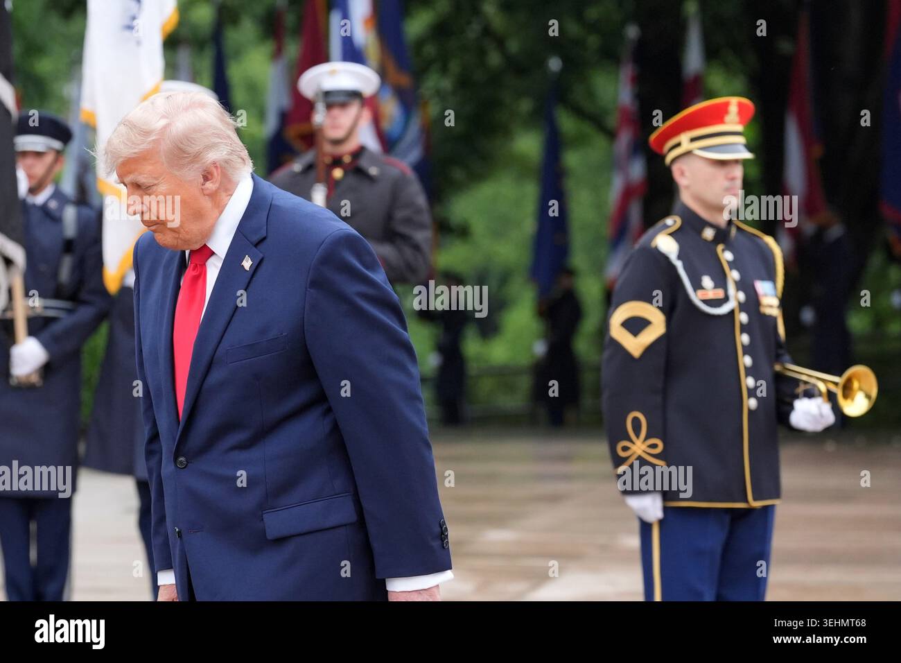 President Donald Trump, left, walks after placing a wreath at the Tomb ...