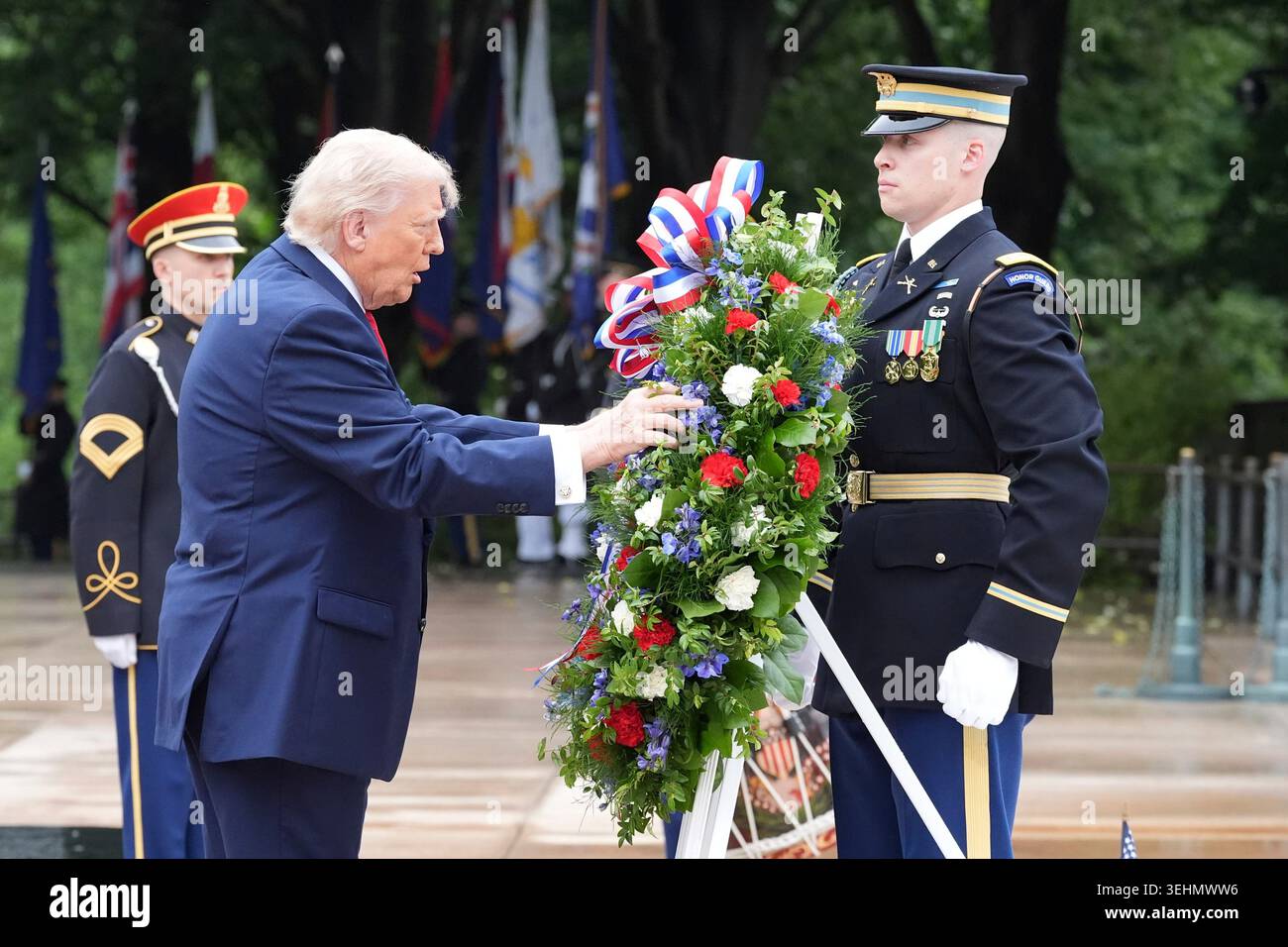 President Donald Trump, left, places a wreath at the Tomb of the ...