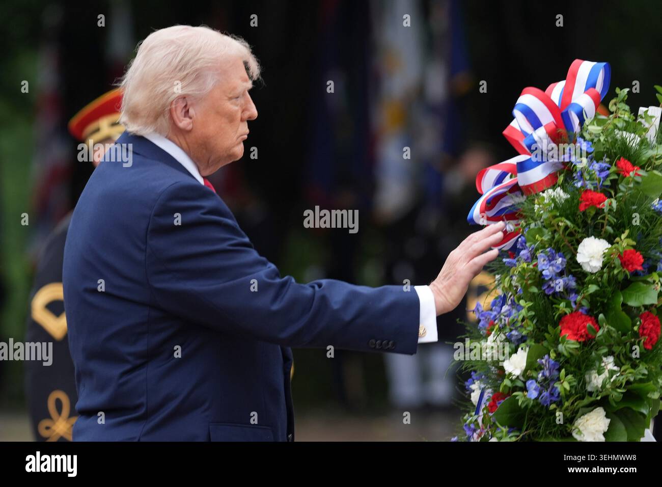 President Donald Trump, left, places a wreath at the Tomb of the ...
