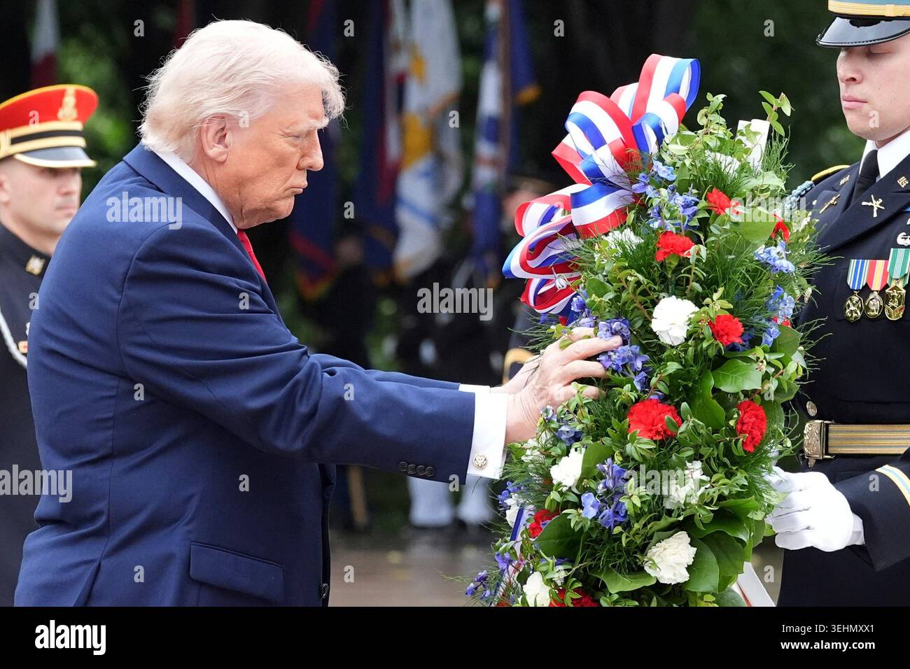 President Donald Trump places a wreath at the Tomb of the Unknown ...