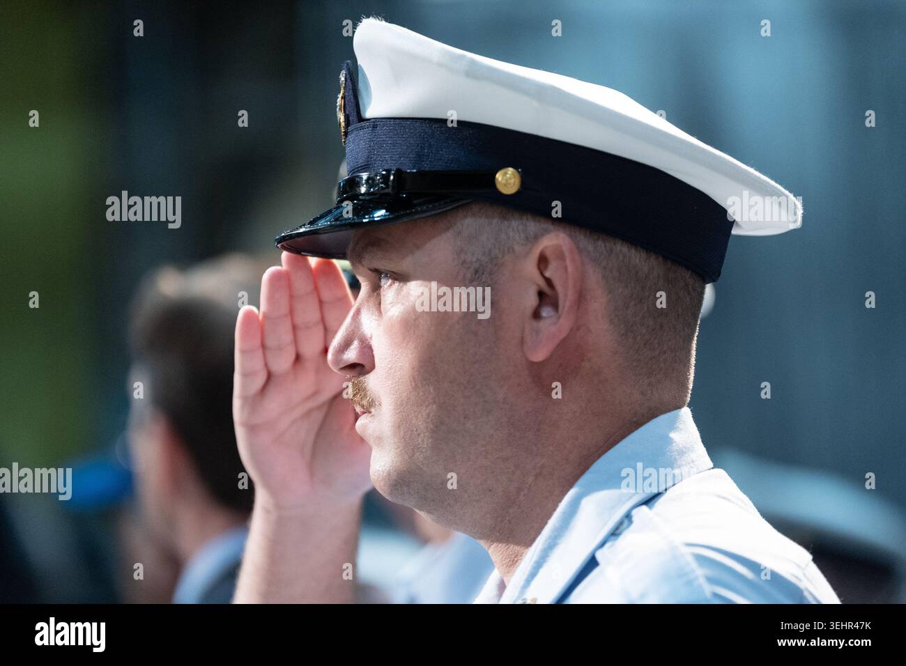 US Coast Guard Dan Phillips salutes during Memorial Day commemoration ...
