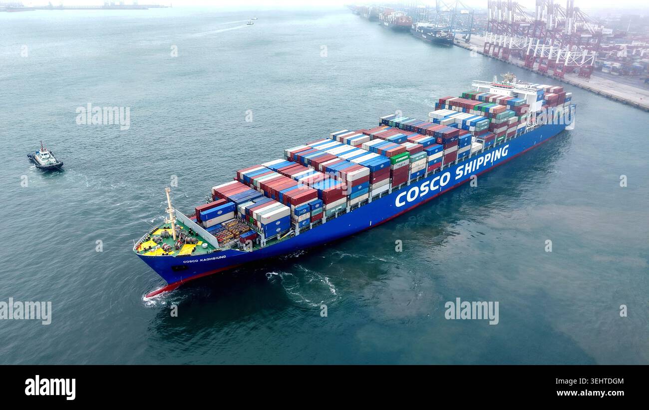 A cargo ship leaves the berth after completing foreign trade container ...