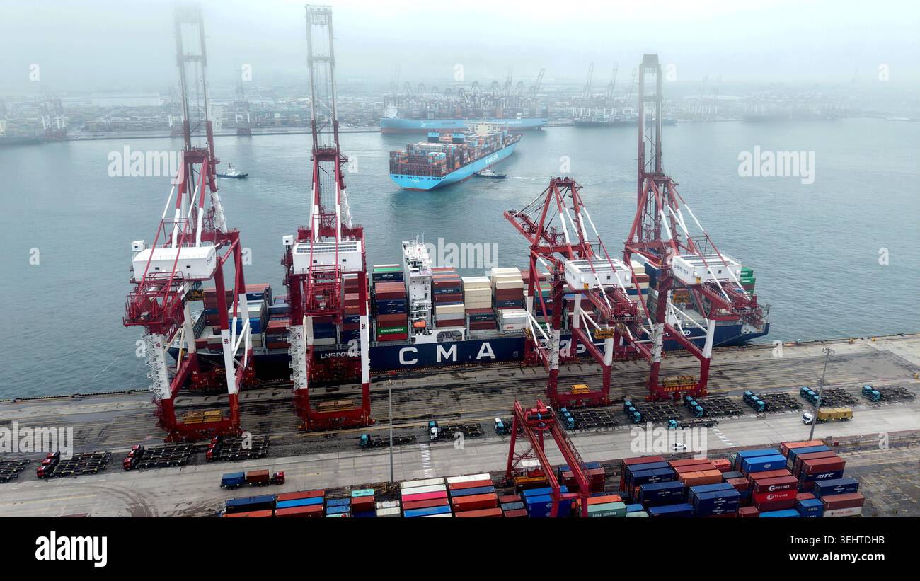 A cargo ship leaves the berth after completing foreign trade container ...