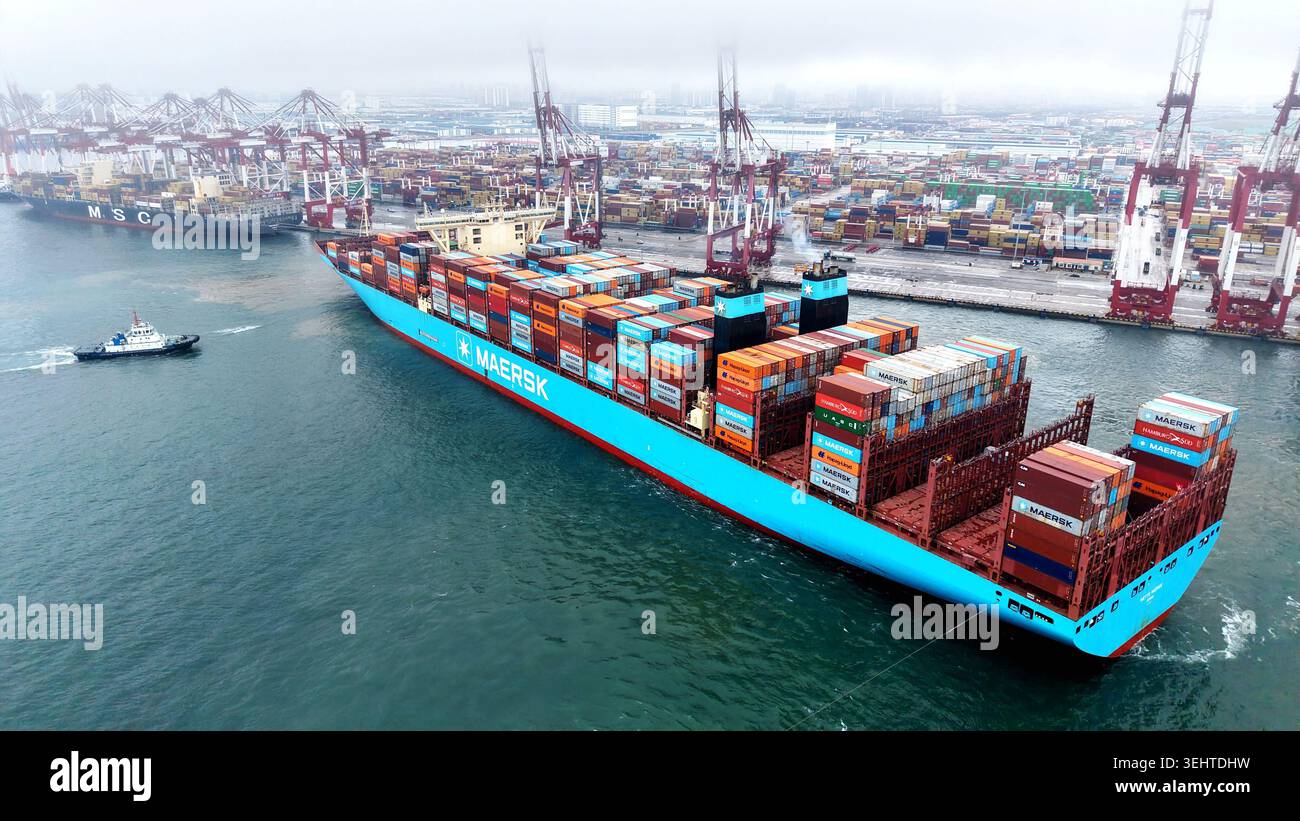 A cargo ship leaves the berth after completing foreign trade container ...