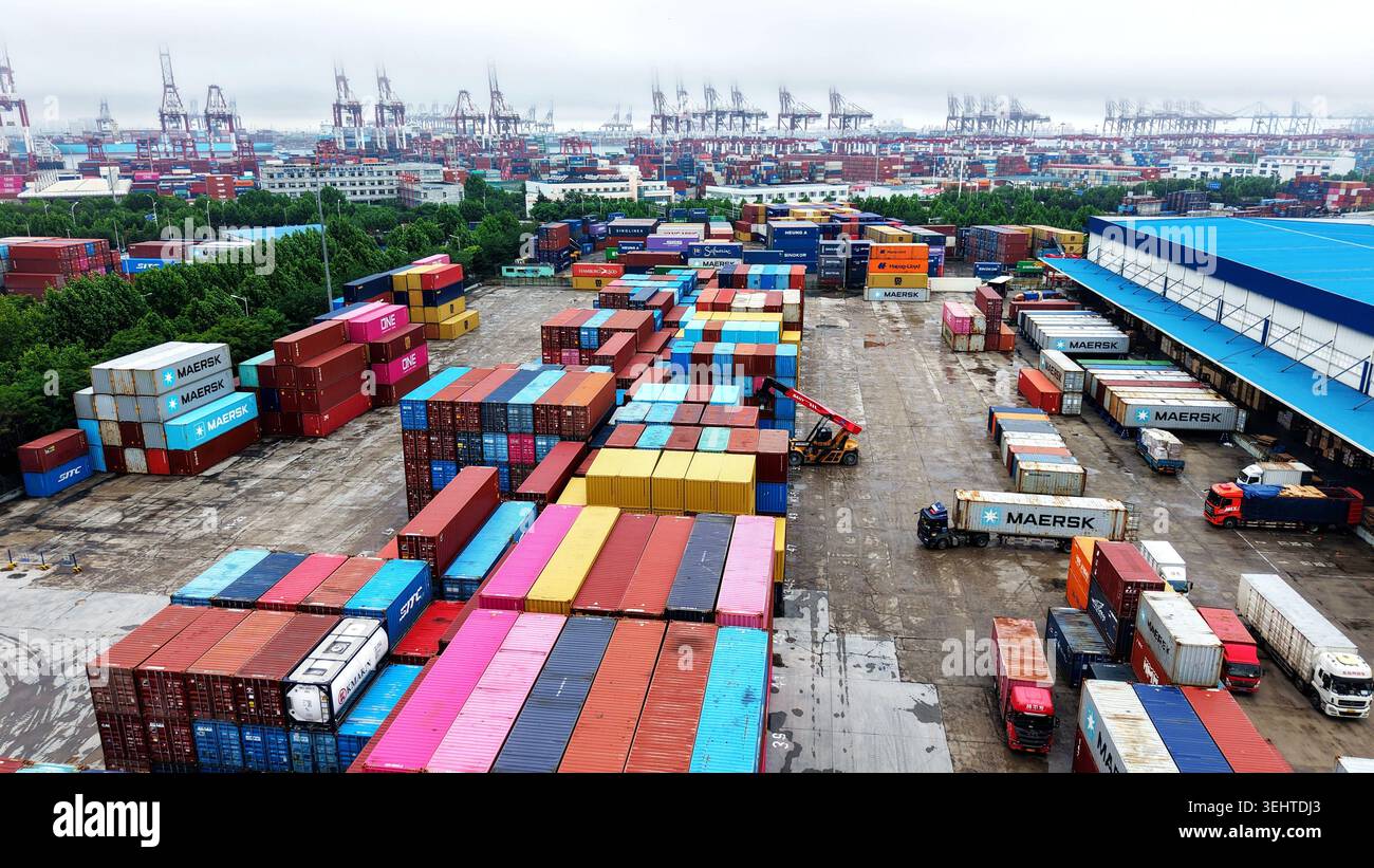 A cargo ship leaves the berth after completing foreign trade container ...