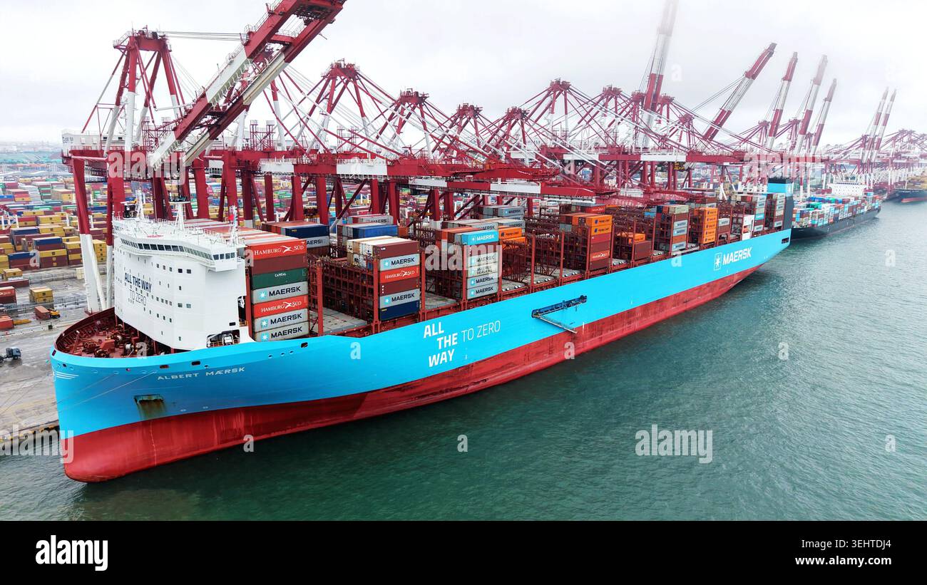 A cargo ship leaves the berth after completing foreign trade container ...
