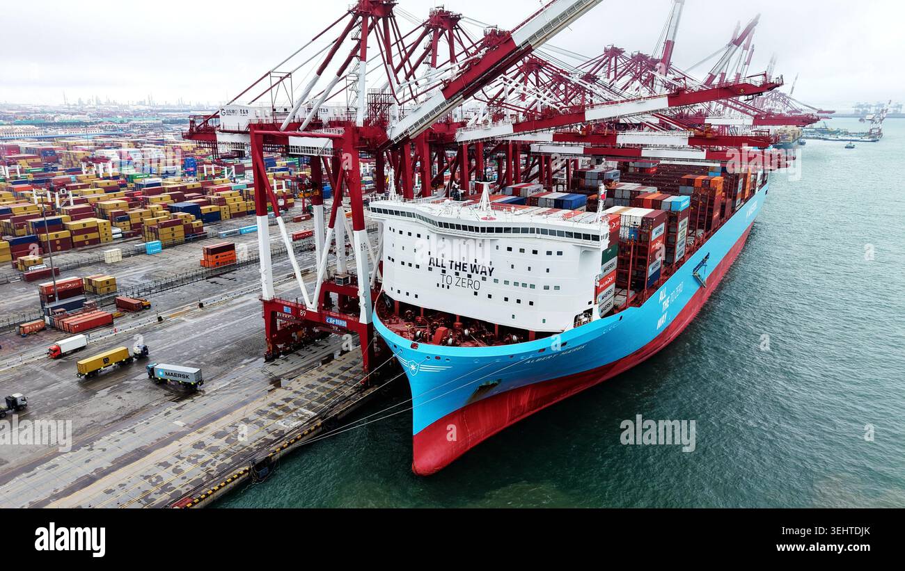 A cargo ship leaves the berth after completing foreign trade container ...