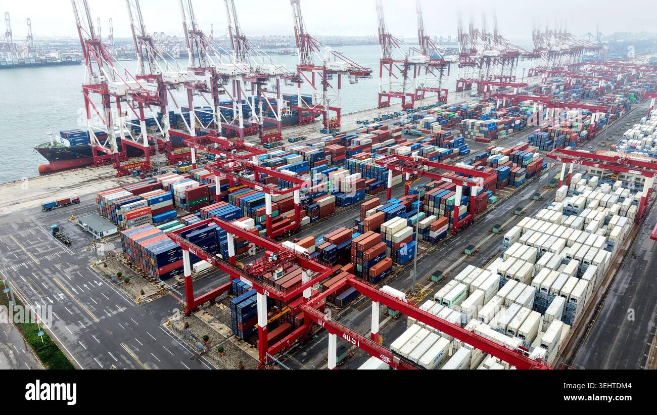 A cargo ship leaves the berth after completing foreign trade container ...