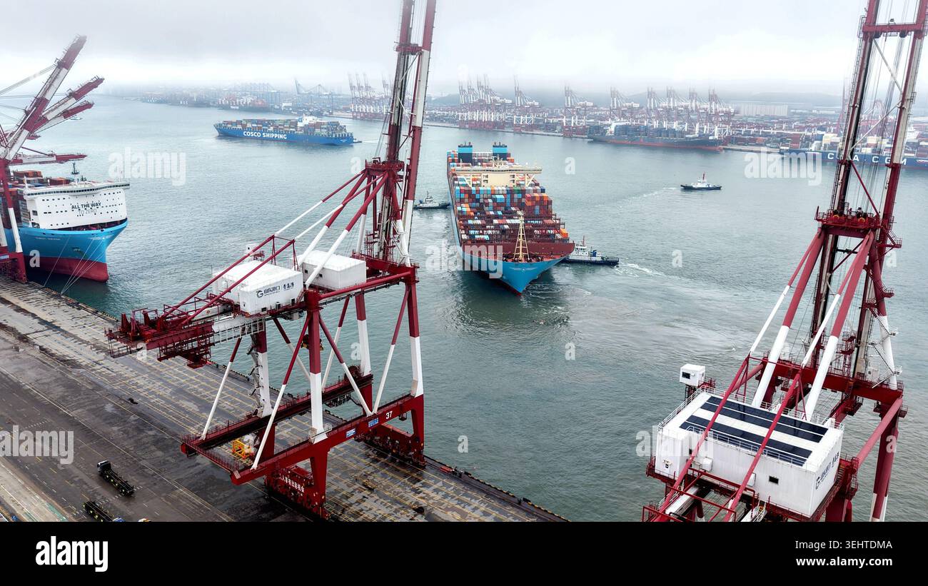 A cargo ship leaves the berth after completing foreign trade container ...