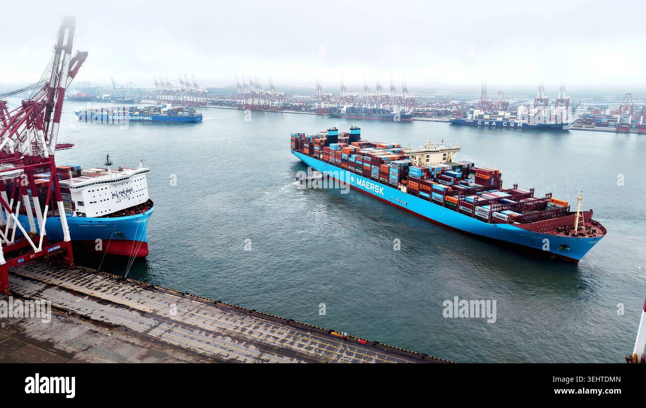 A cargo ship leaves the berth after completing foreign trade container ...