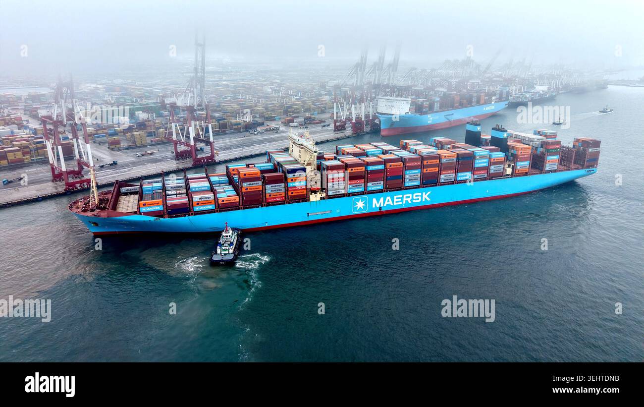 A cargo ship leaves the berth after completing foreign trade container ...