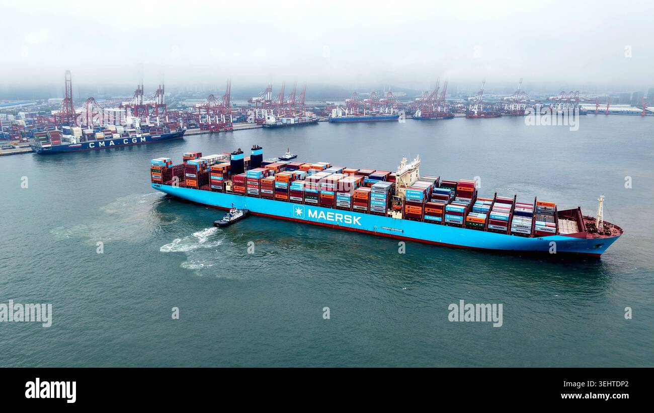 A cargo ship leaves the berth after completing foreign trade container ...