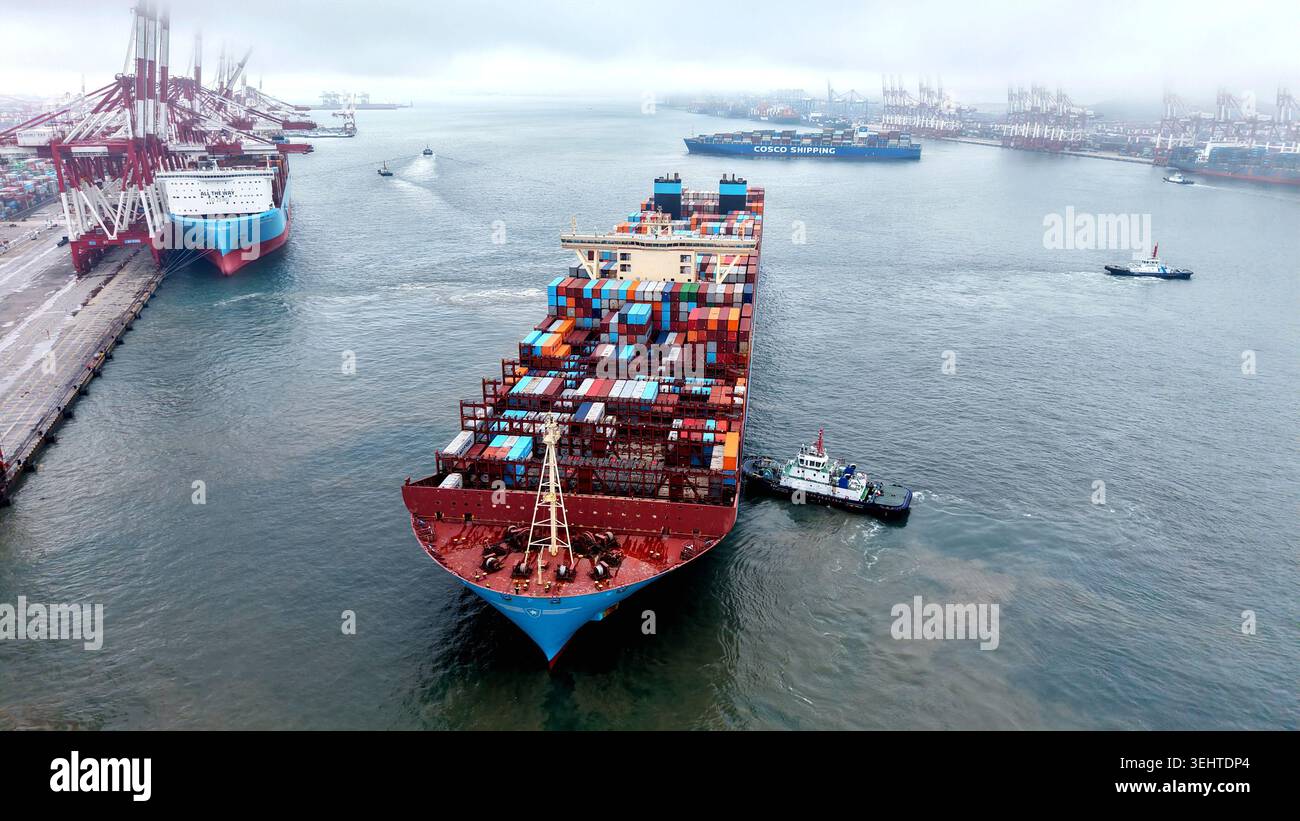 A cargo ship leaves the berth after completing foreign trade container ...