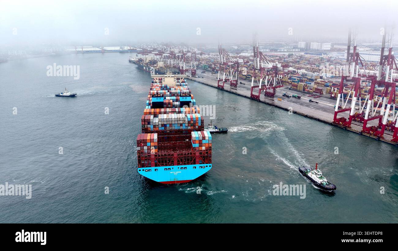 A cargo ship leaves the berth after completing foreign trade container ...