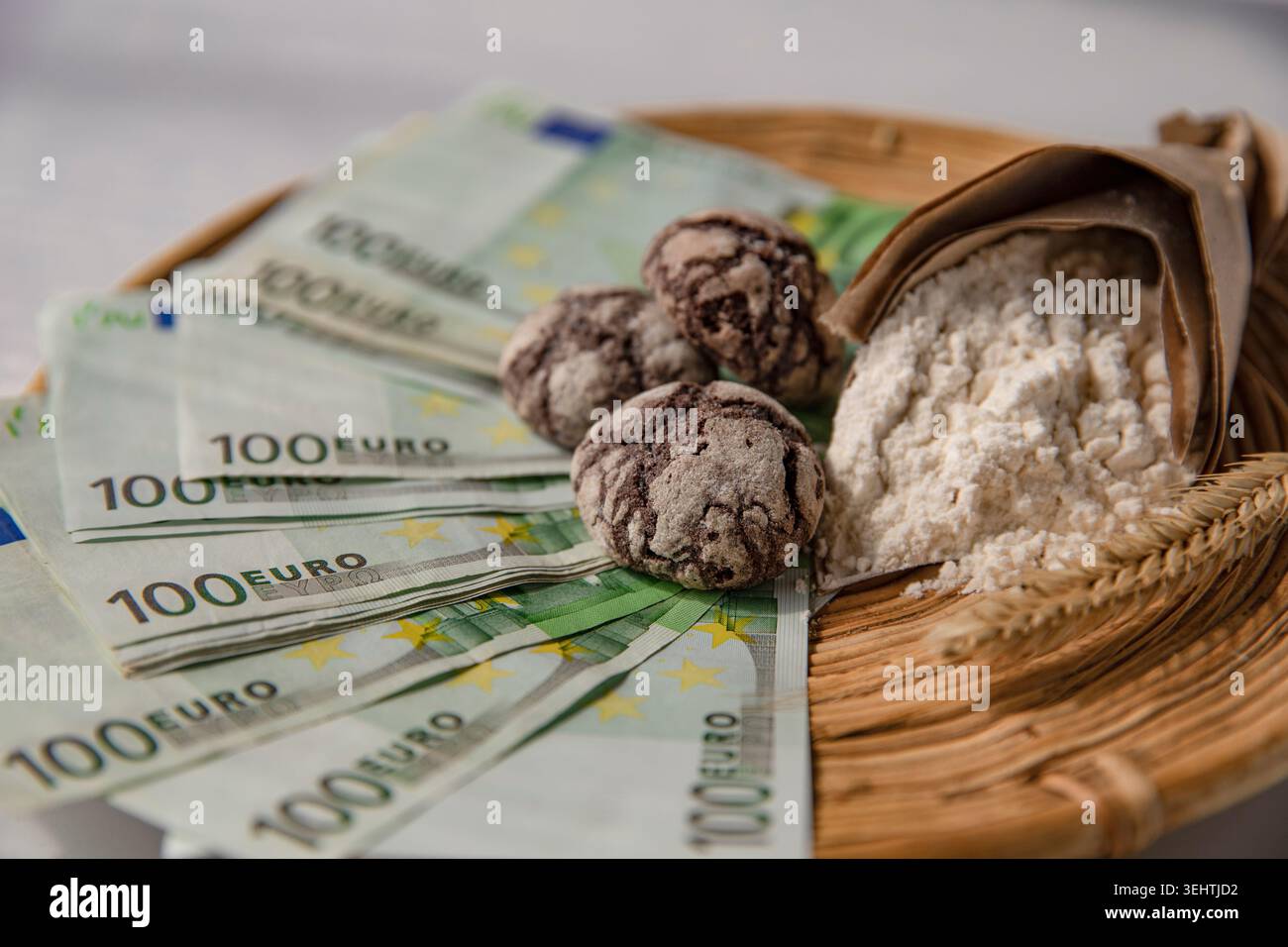 Euro banknotes with flour in paper bag on wicker tray for food prices ...