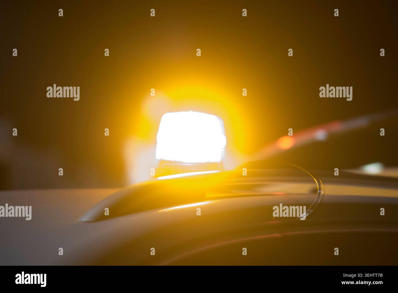 orange flashing light for a car, warning signal in road traffic orange ...