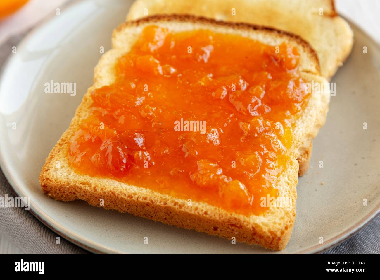 Sweet Homemade Apricot Jam on Toast for Breakfast Stock Photo - Alamy